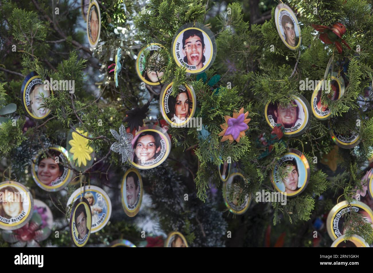 Photographs of the Cromanon tragedy victims are placed on a Christmas ...