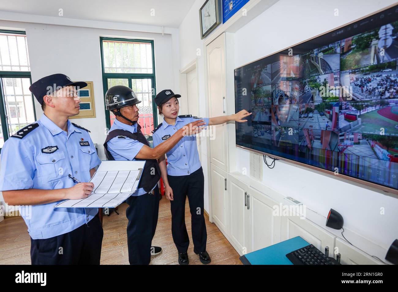 ZHOUSHAN, CHINA - AUGUST 31, 2023 - Police check a school surveillance ...