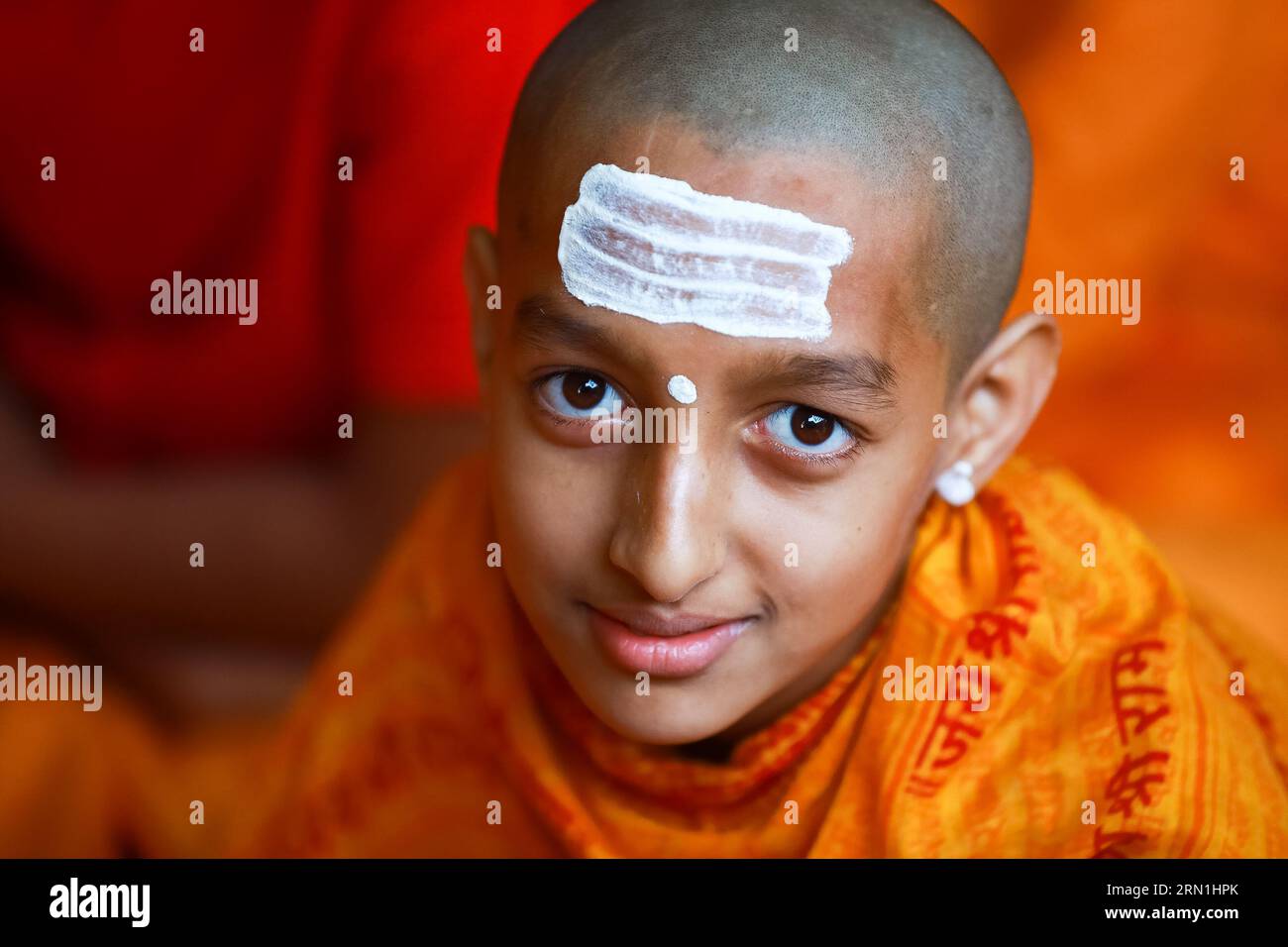Kathmandu, Nepal. 31st Aug, 2023. A Hindu priest looks on while ...