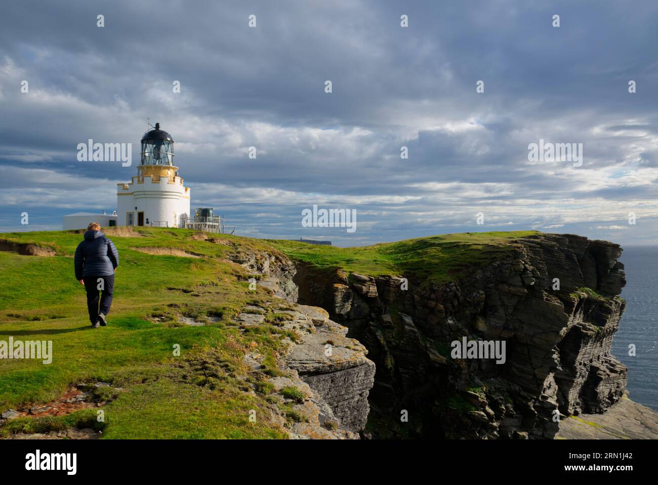 Walking on Brough of Birsay with Lighthouse, Orkney Islands Stock Photo ...