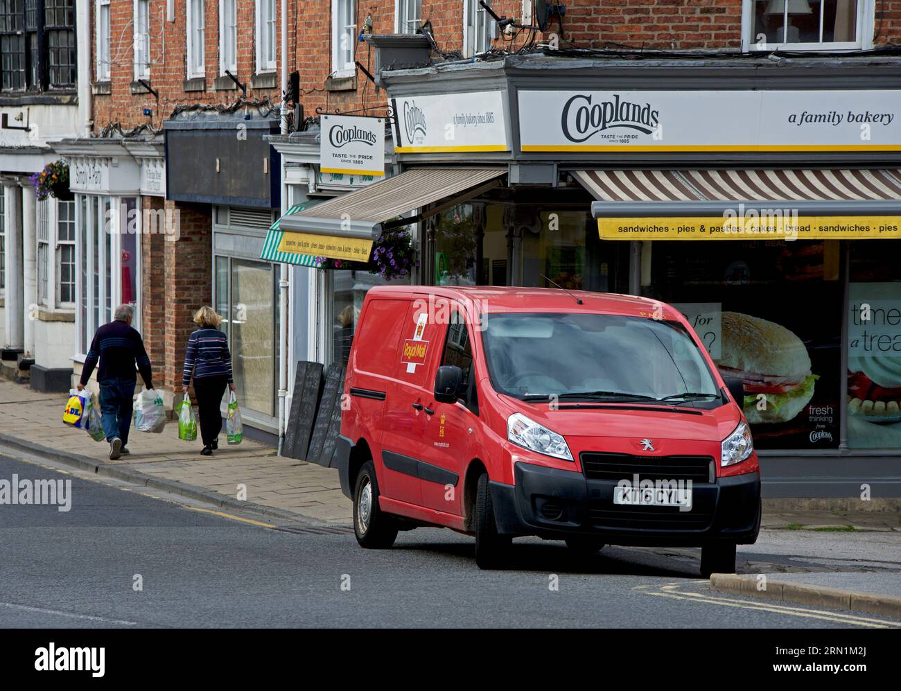 Royal mail van parked in high street hi-res stock photography and ...