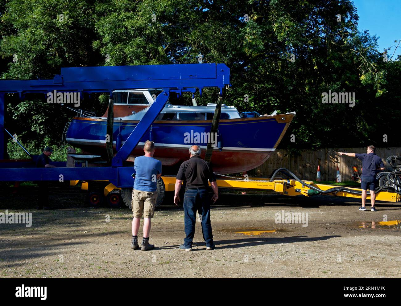 Boat being launched, by tractor, onto the River Ouse, at Acaster Maine ...