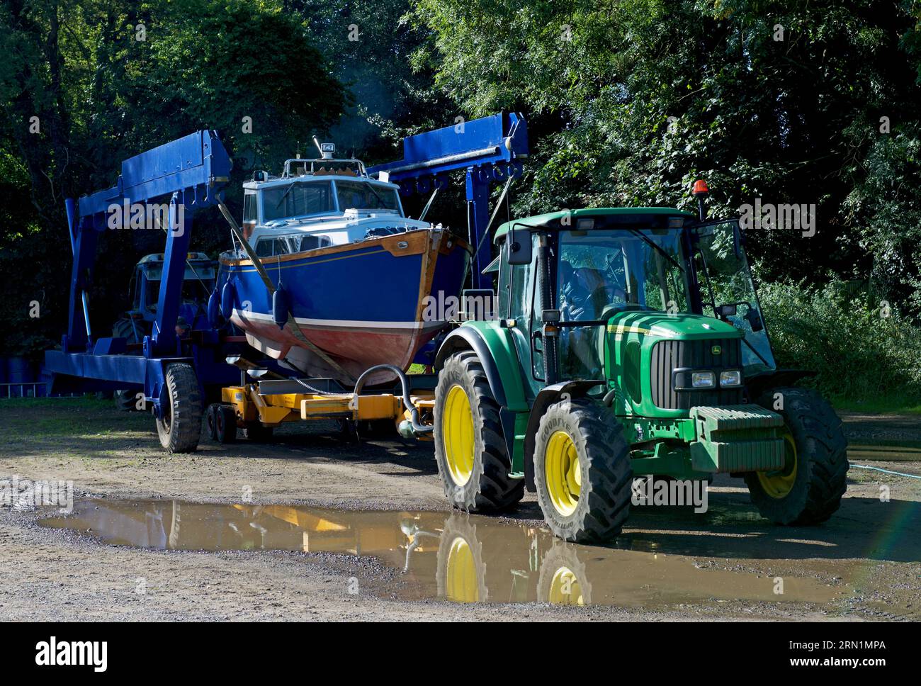Boat being launched, by tractor, onto the River Ouse, at Acaster Maine ...