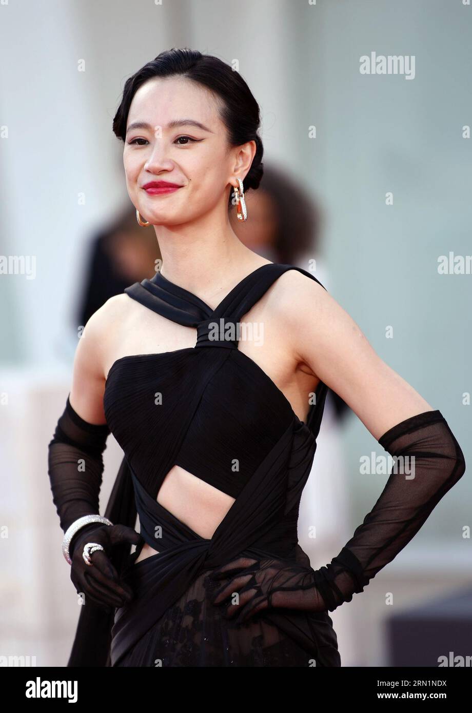 Venice, Italy. 30th Aug, 2023. Actress Li Meng poses on the red carpet of the 80th Venice ...