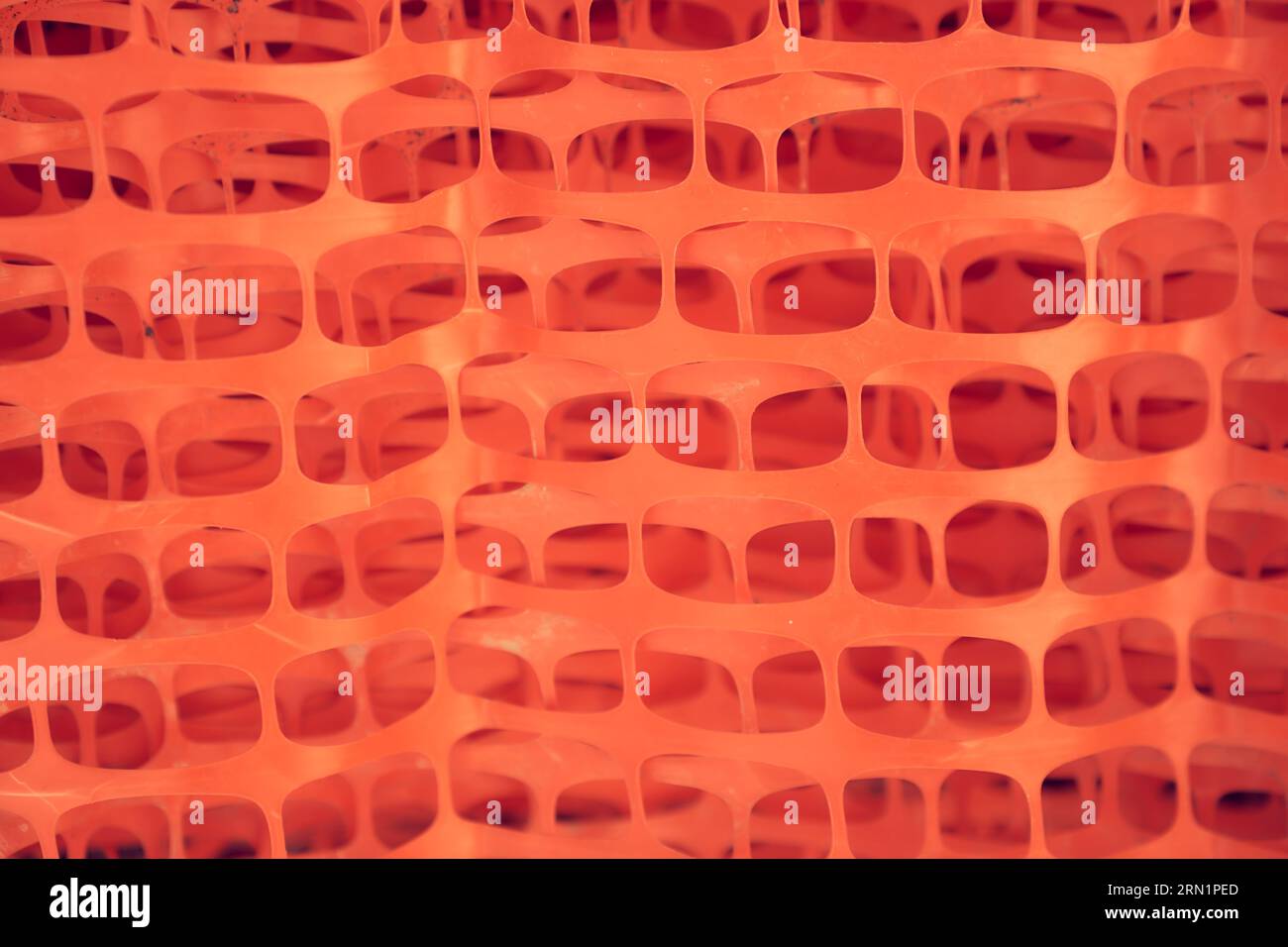 Reinforcing mesh for plaster. Orange construction mesh in rolls in a ...