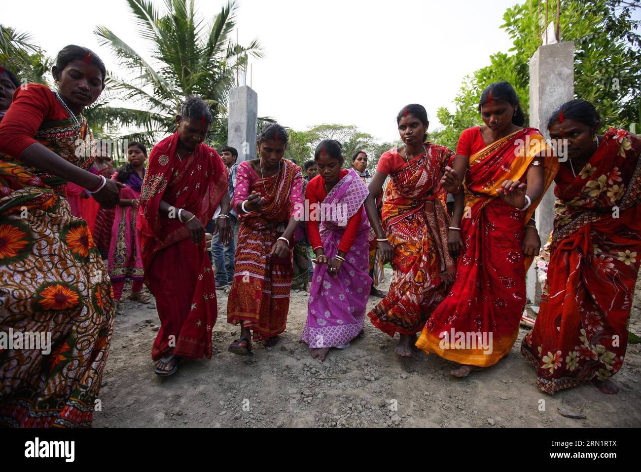Local villagers dance during a ritual ceremony in a village at the ...