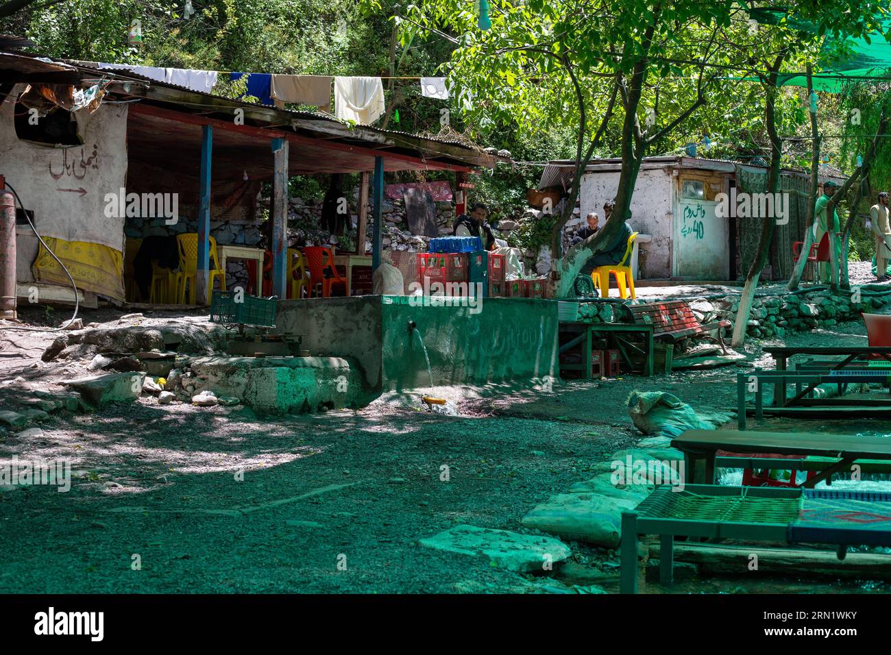 A cozy sitting area in Kewai, Pakistan with armchairs and tables ...