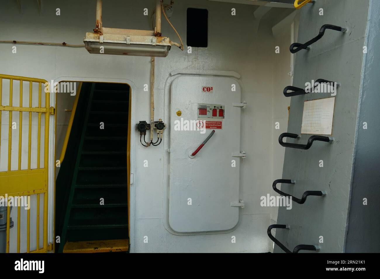 White metal door with stickers is closing the entrance to CO2 room on ...