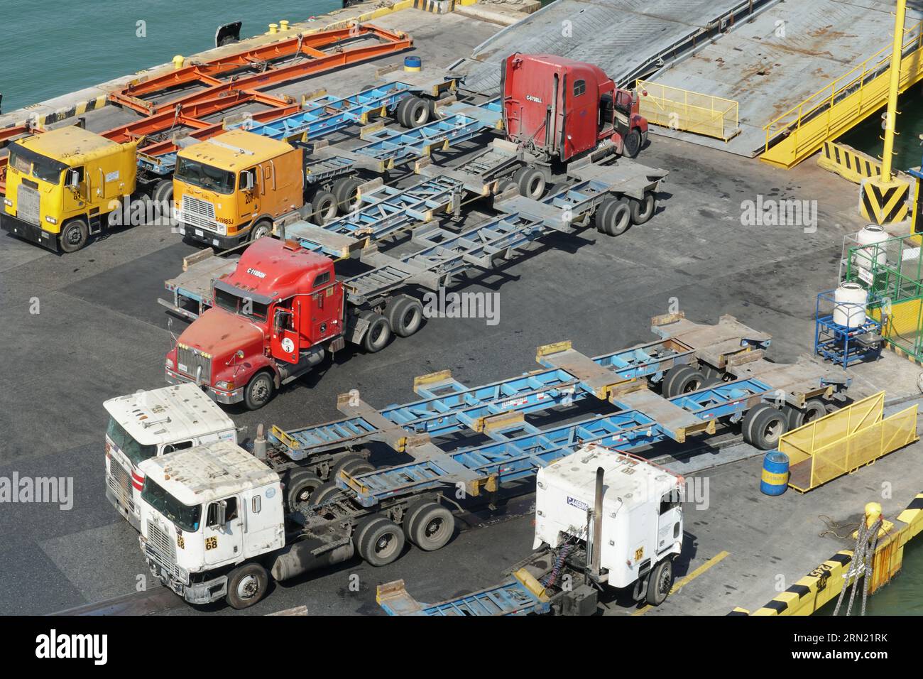 Empty lorries and trucks parked on a loading pier next floating pontoon ...