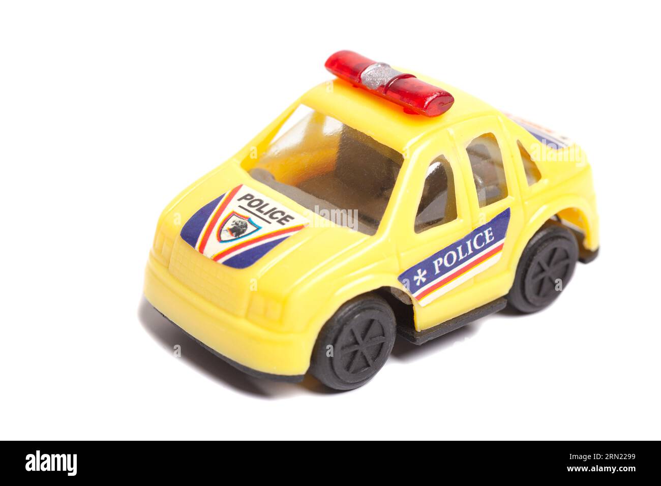 Yellow toy police car isolated on white background Stock Photo - Alamy