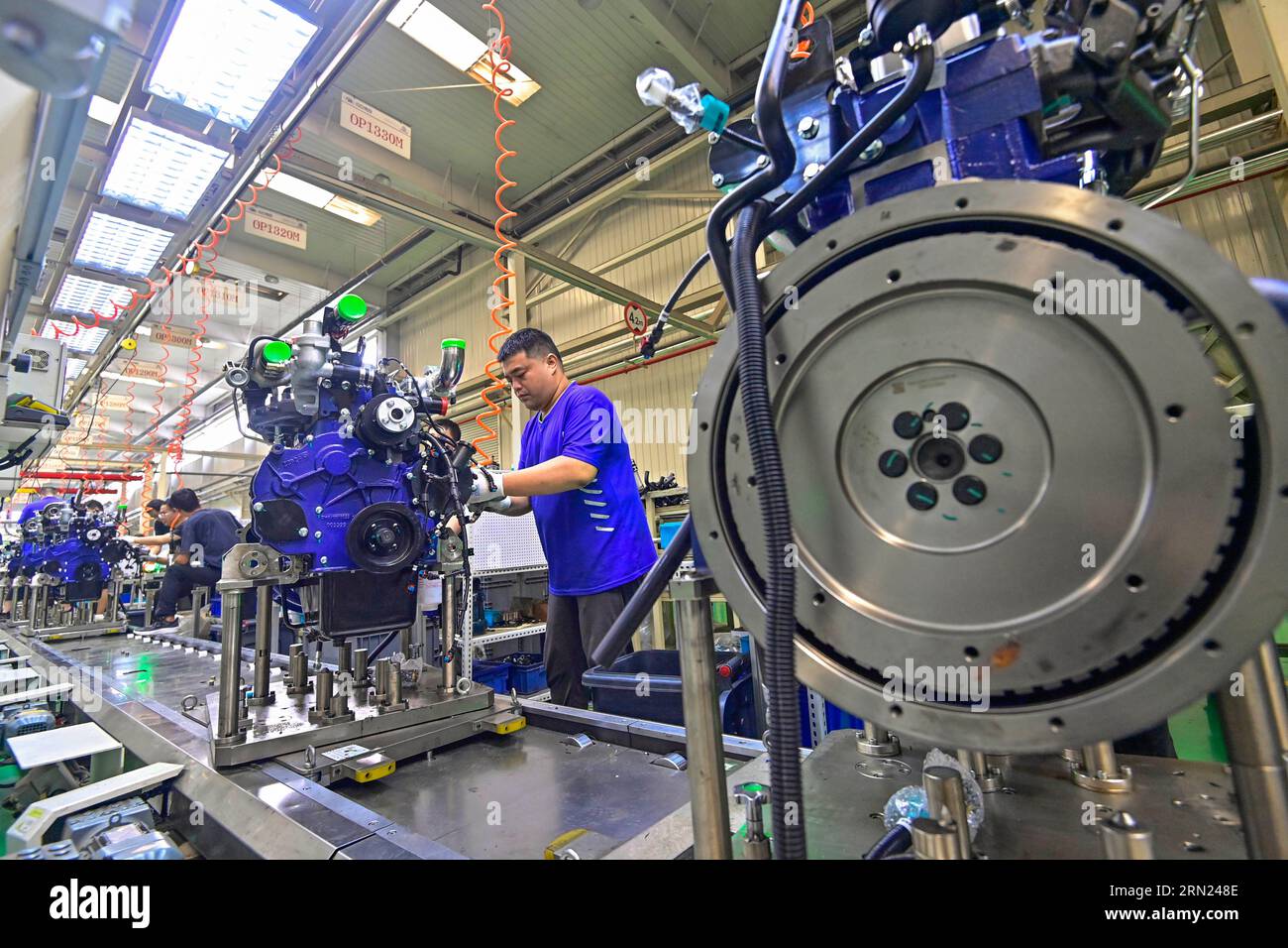 QINGZHOU, CHINA - AUGUST 31, 2023 - Workers assemble on a production ...