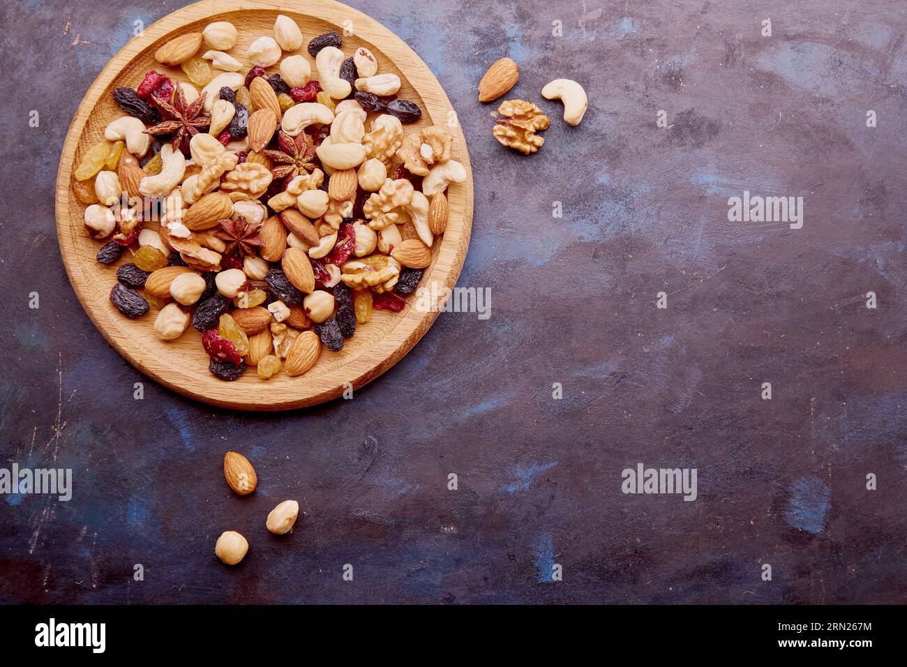 Aesthetic wooden bowl with assorted nuts, raisins and cranberries from ...