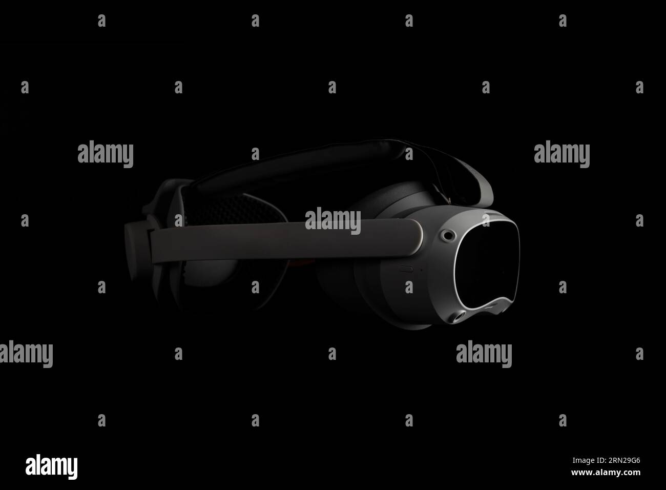 Virtual reality headset isolated on black background. Low key ...
