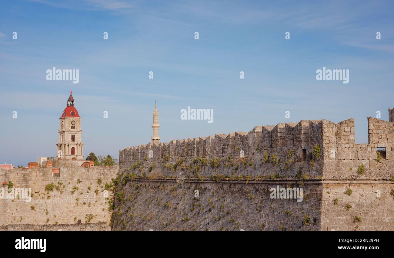 The walls of the medieval city of Rhodes, the clock tower inside the ...