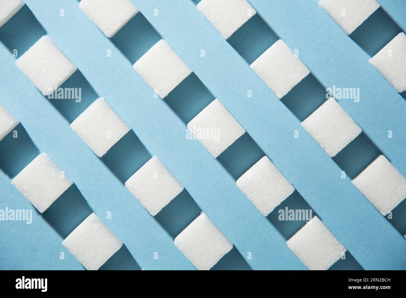 Pattern of sugar cubes on white background Stock Photo - Alamy