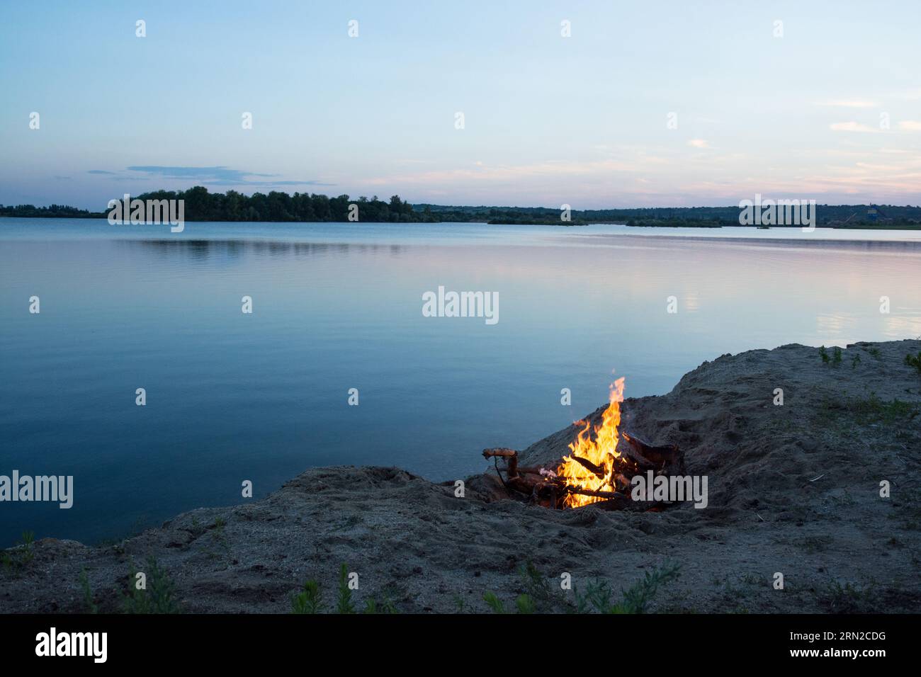 Campfire on shore lake hi-res stock photography and images - Alamy