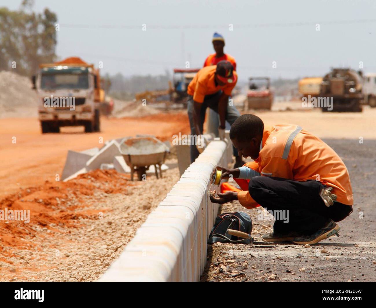 Employees of of Chinese Road and Bridge Corporation work at the ...