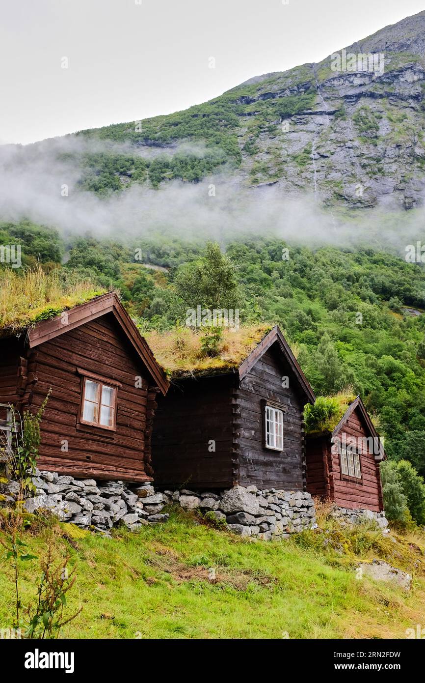 Traditional Norwegian houses made of wood, stand on foundation of ...