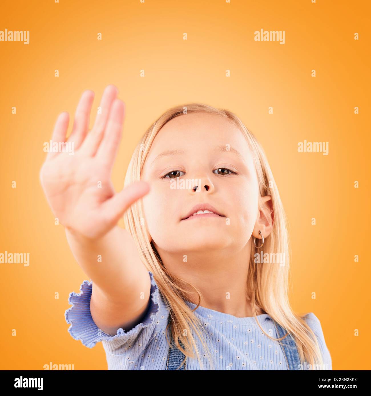 Stop, hand and portrait of girl child in studio with no, warning or ...