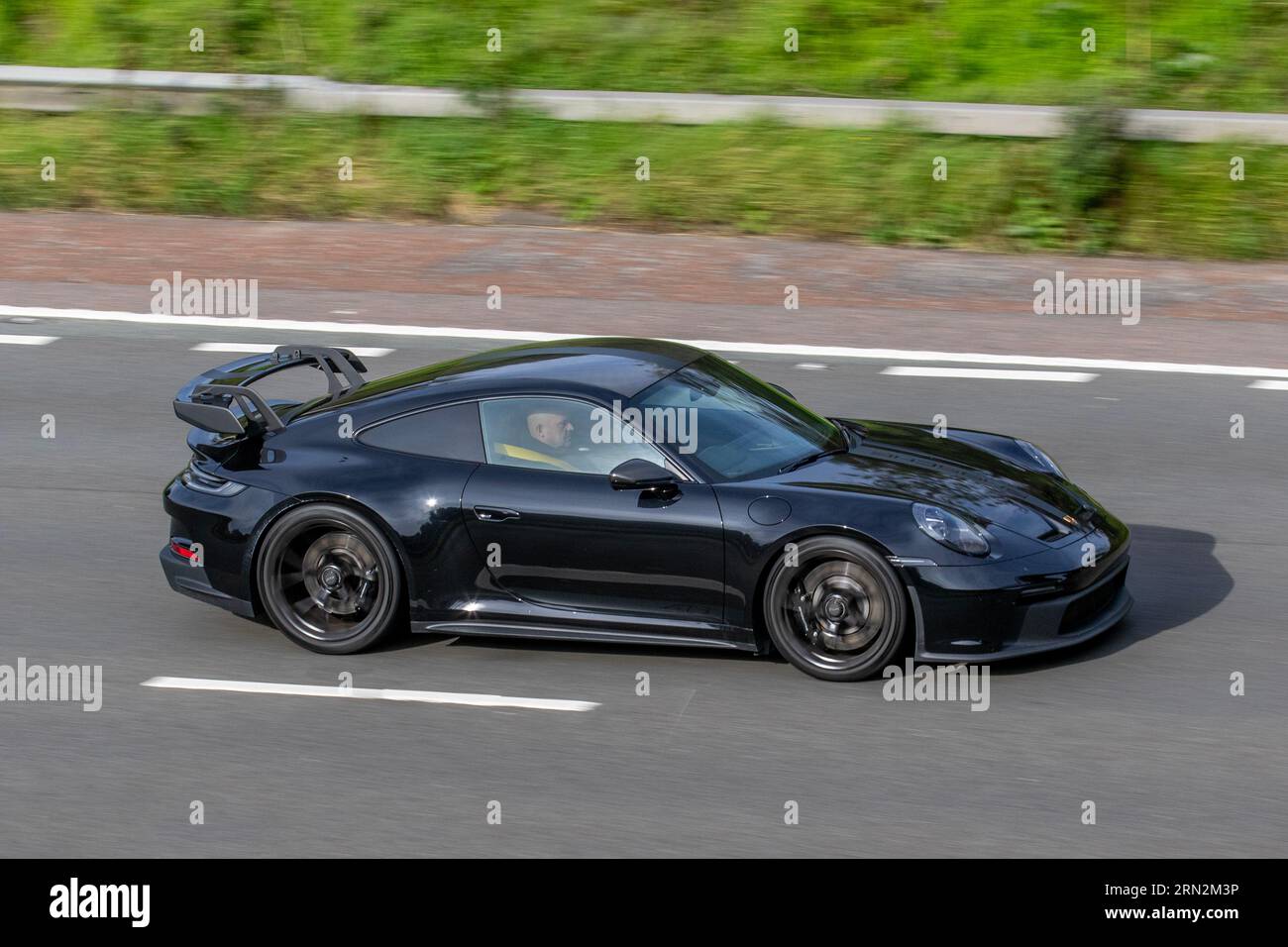 2002 Black Porsche 911 997 Turbo coupe; travelling at speed on the M6 ...
