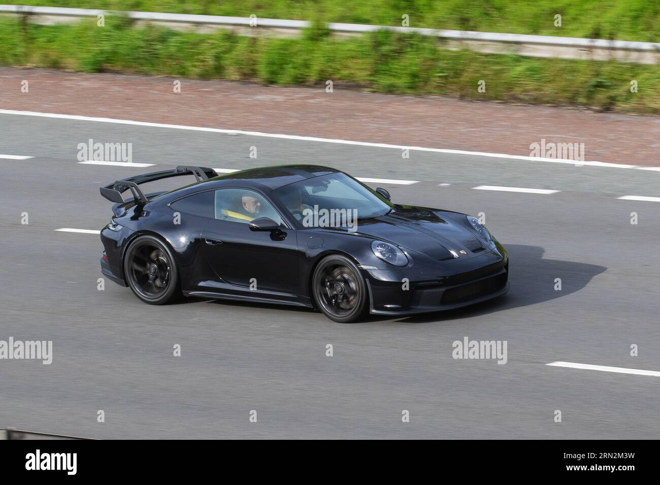 2002 Black Porsche 911 997 Turbo coupe; travelling at speed on the M6 ...