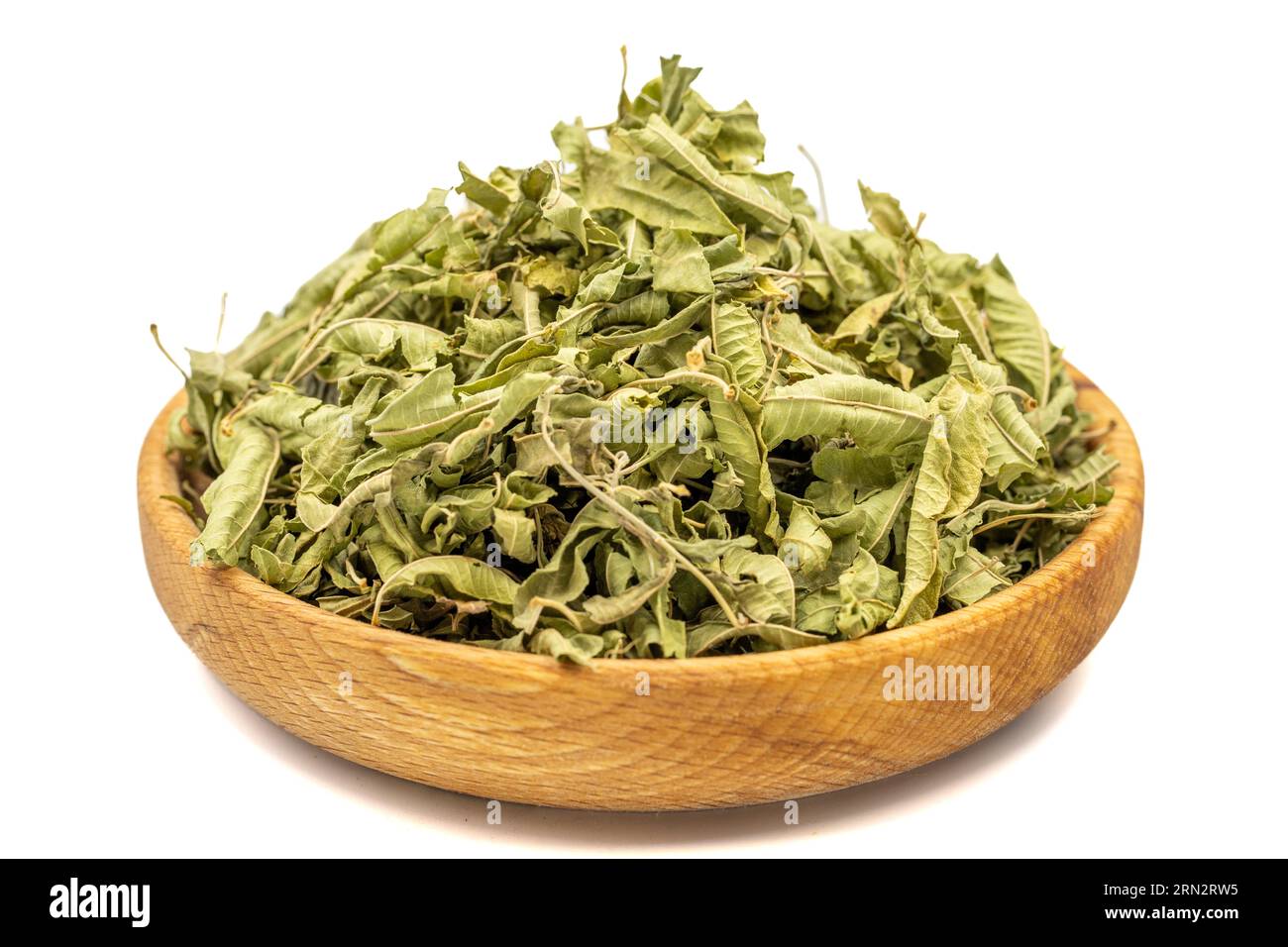 Melissa tea leaves. Sun-dried lemon balm tea leaves in wood bowl ...
