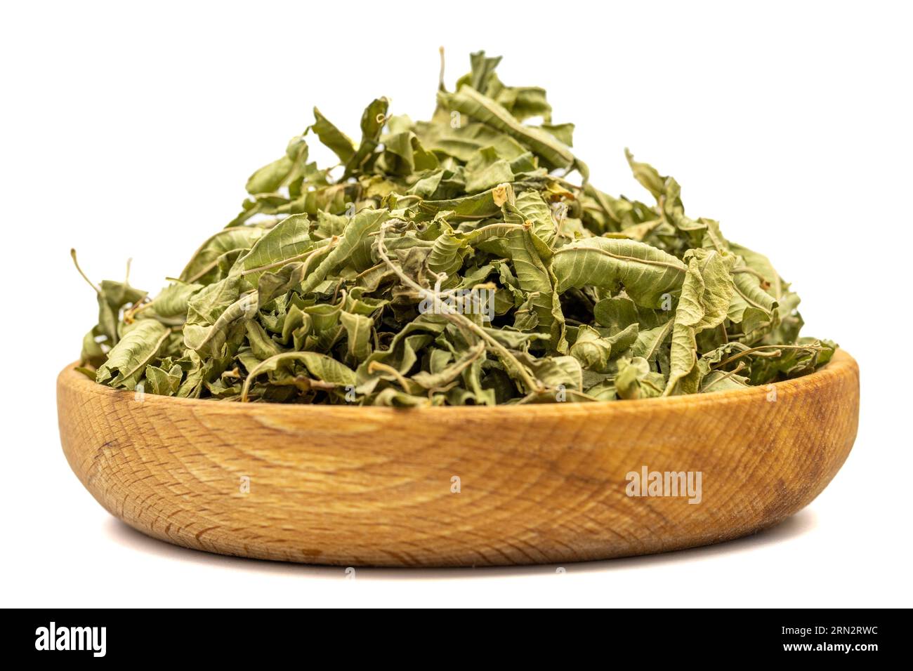 Melissa tea leaves. Sun-dried lemon balm tea leaves in wood bowl ...