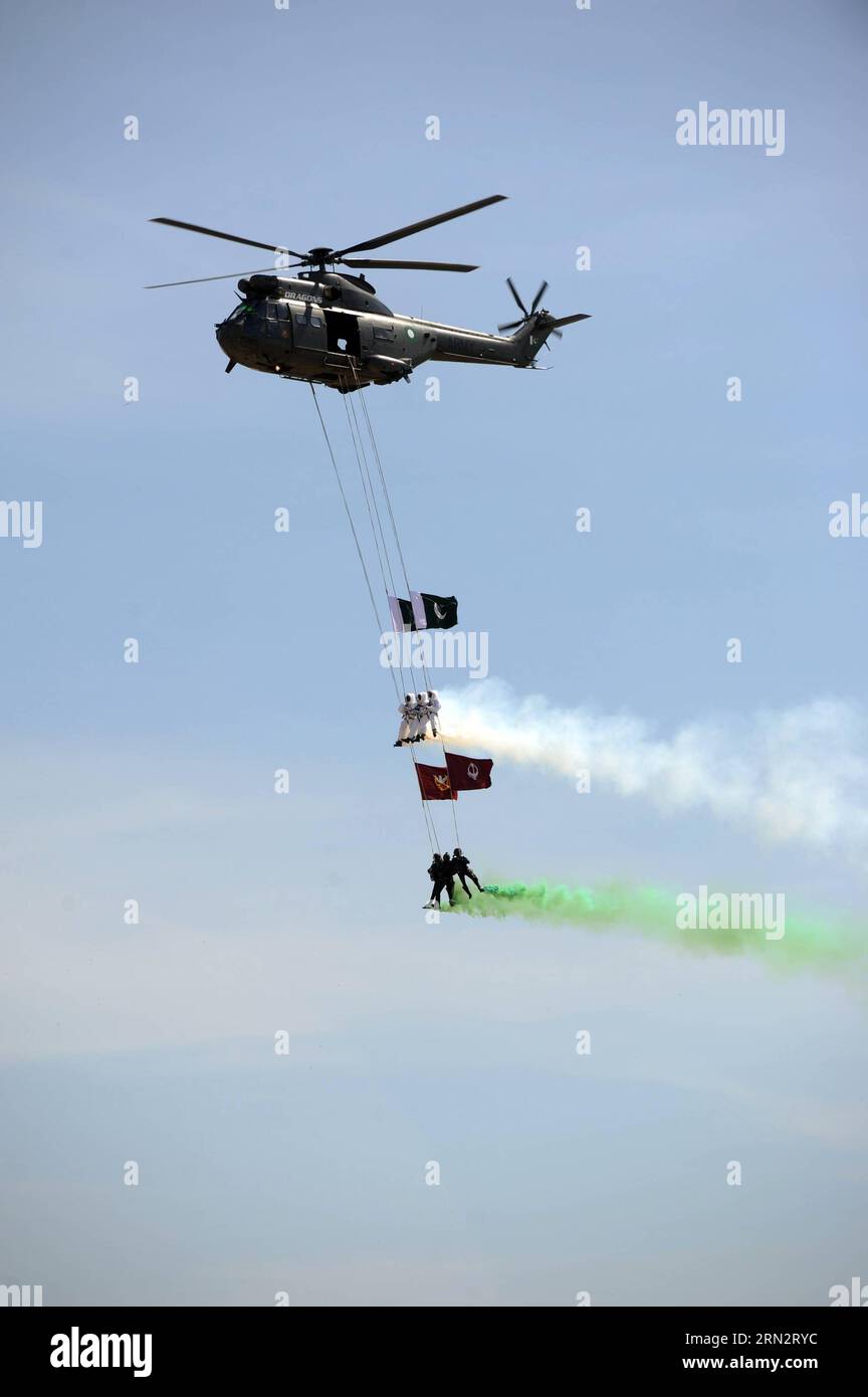 (150323) -- ISLAMABAD, March 23, 2015 -- Pakistani commandos hang from ...