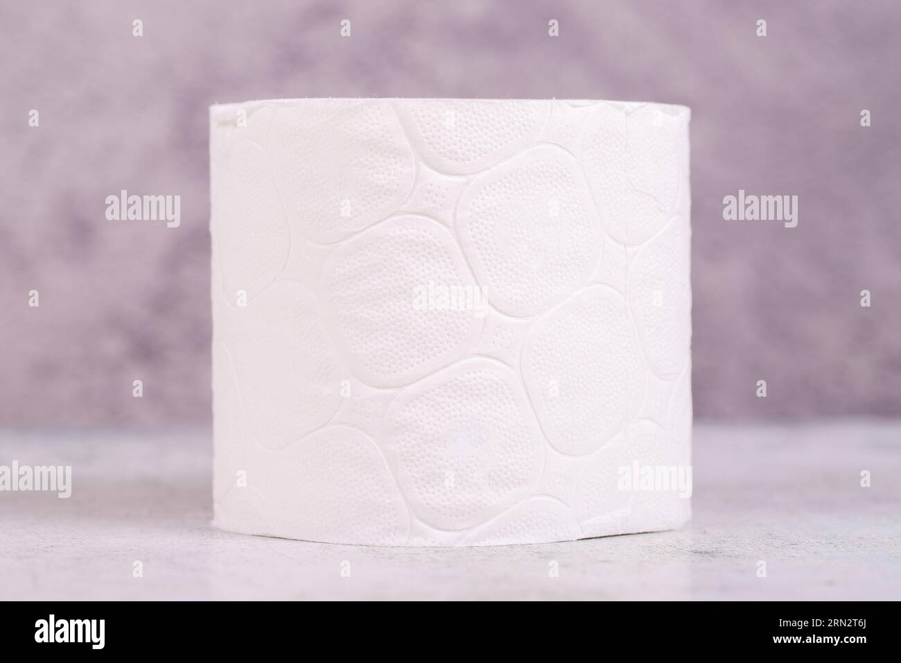 Toilet paper. Toilet paper rolls on gray background Stock Photo - Alamy