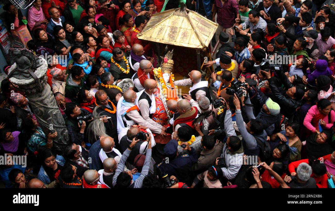 Priests carry an idol of Seto Machhendranath during a procession to ...