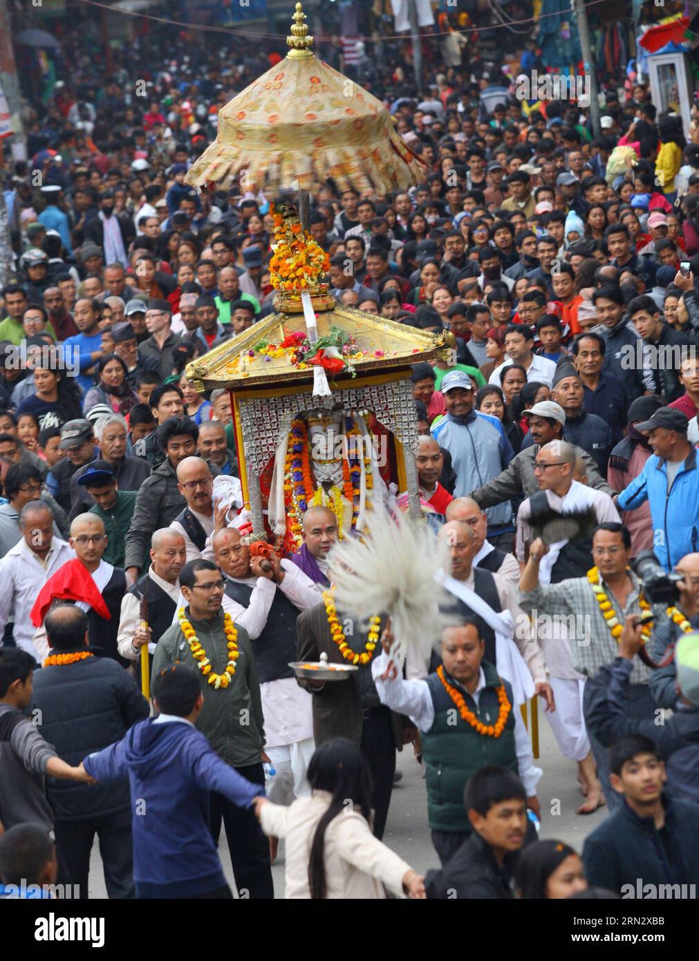 People carry an idol of Seto Machhendranath from a temple to a chariot ...