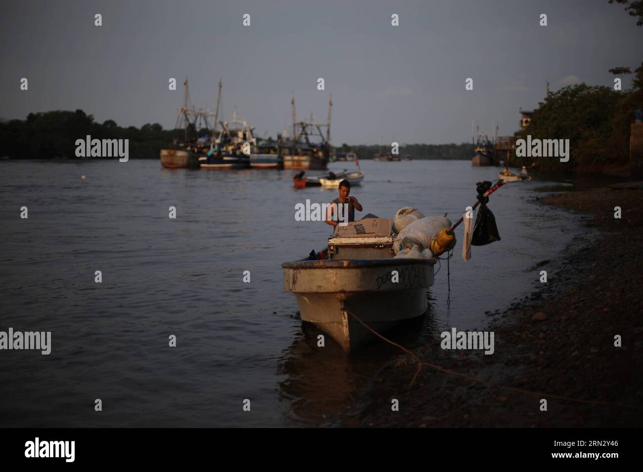Image taken on March 27, 2015, shows a fisherman preparing his boat to ...