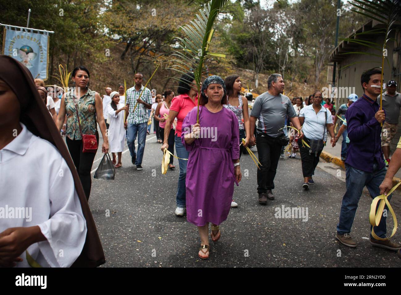 People hold palms during a procession to celebrate the Sunday Palm ...