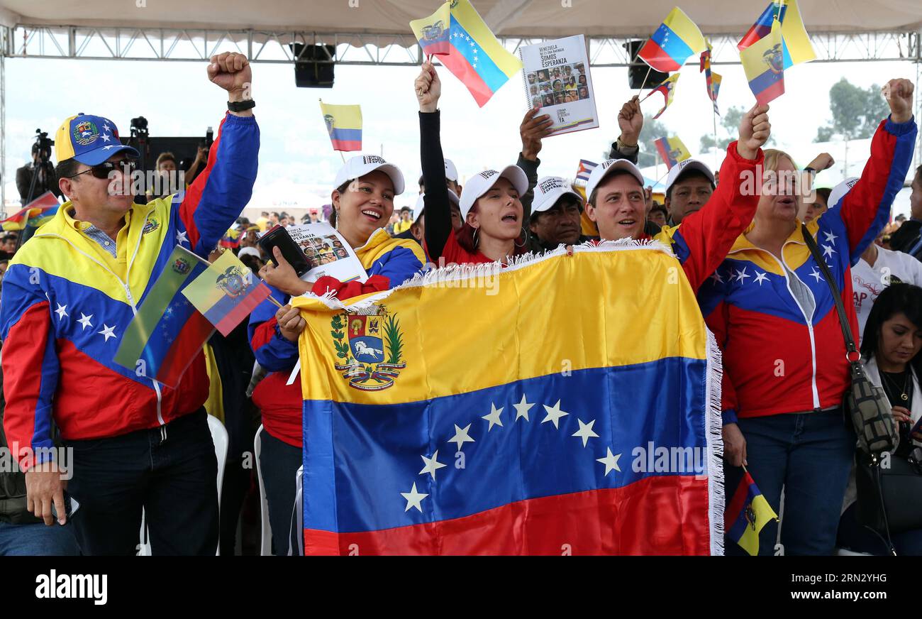 Venezuelan citizens hold a flag during a campaign to collect signatures ...