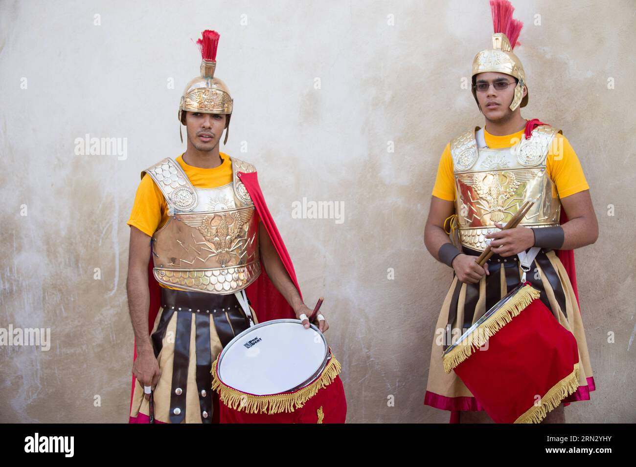 People disguised as members of the Roman Guard react before a ...