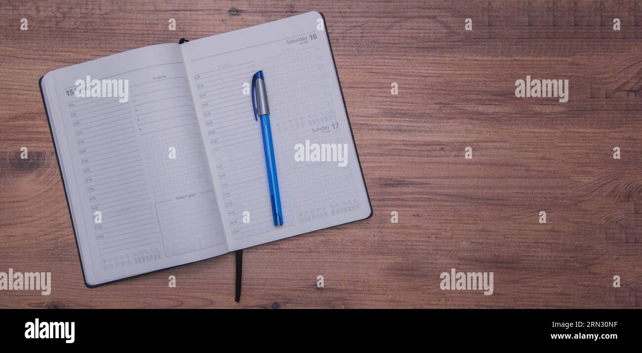 Open notebook and pen on wooden background.Flat lay .Top view Stock ...