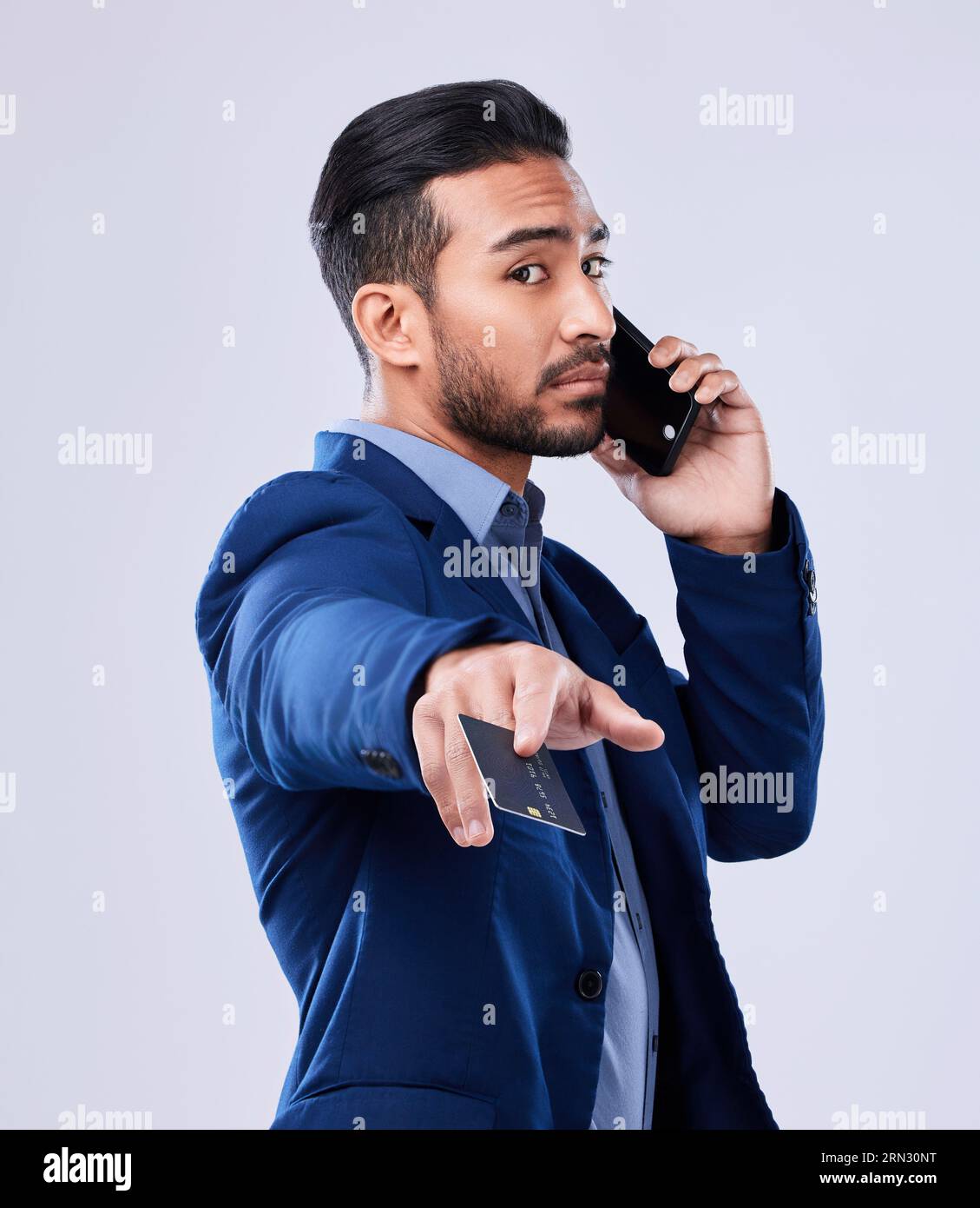 Phone call, credit card and a business man in studio for communication ...