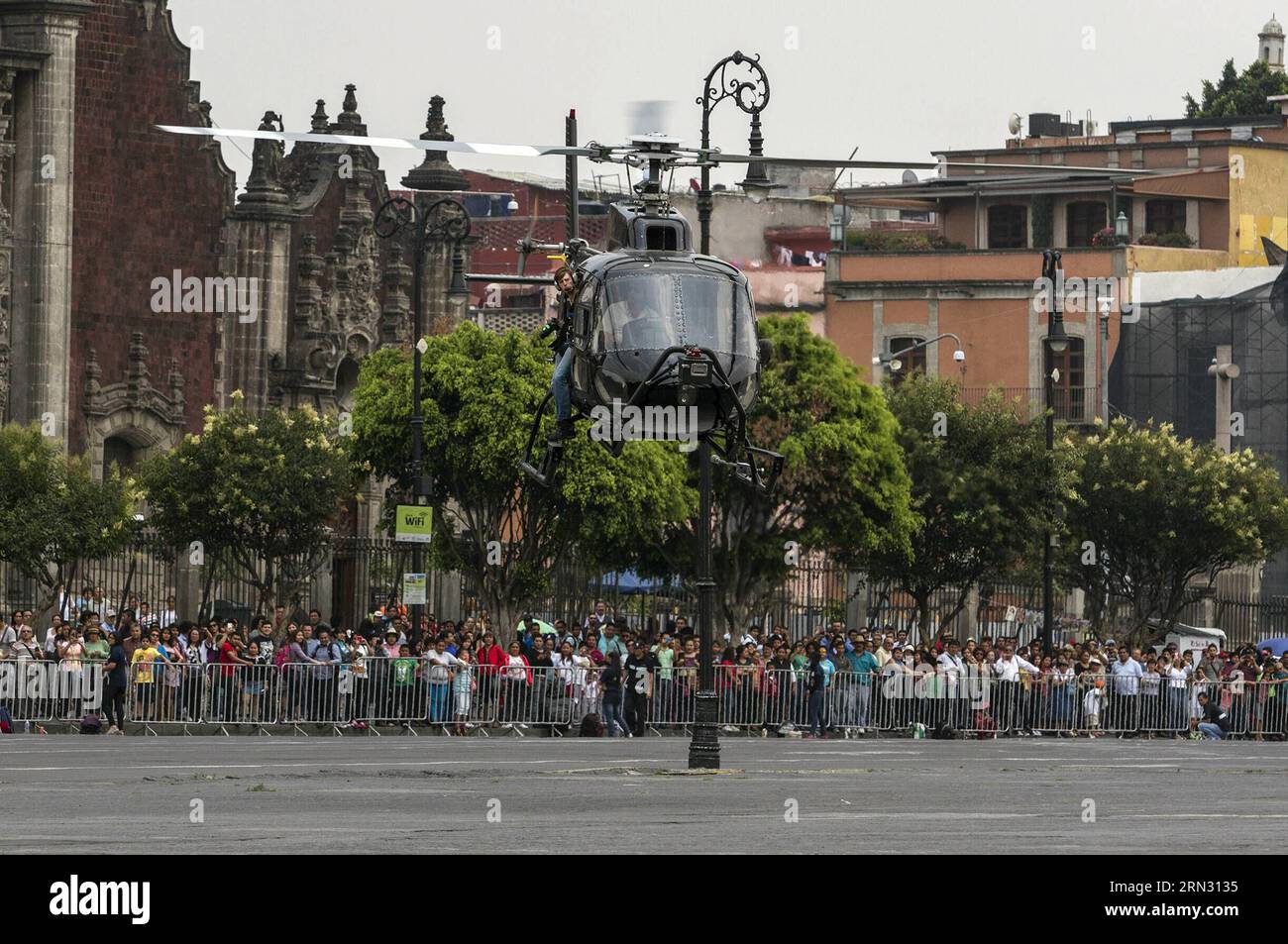 People watch the filming of new James Bond movie Spectre in downtown ...