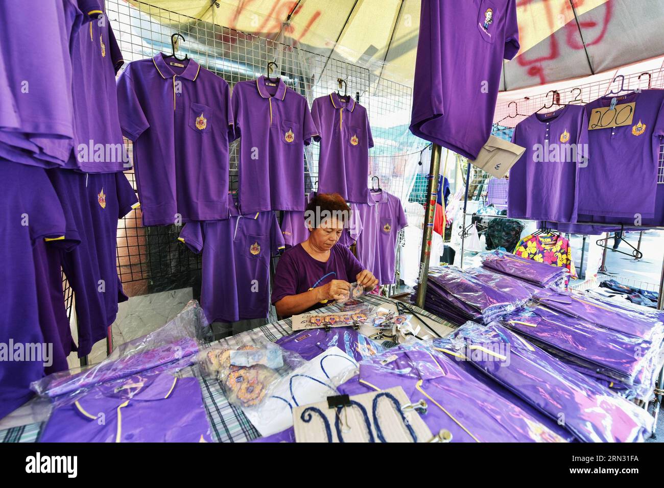 A street vendor sells violet T-shirts which are themed on Princess Maha ...