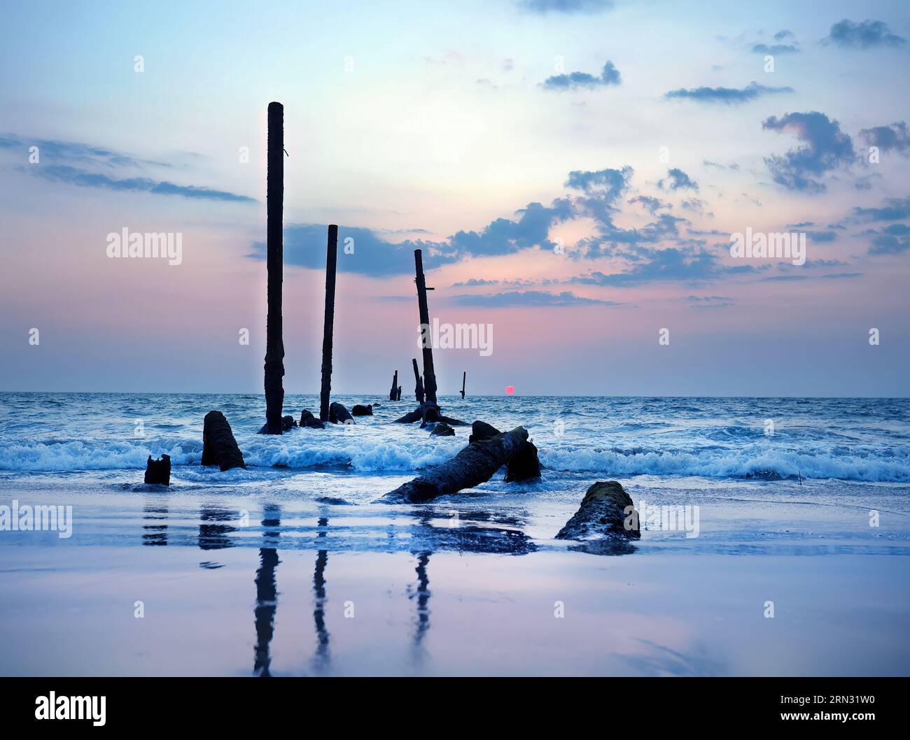 Evening sunset in blue sky, dawn at the beach with silhouette of ...