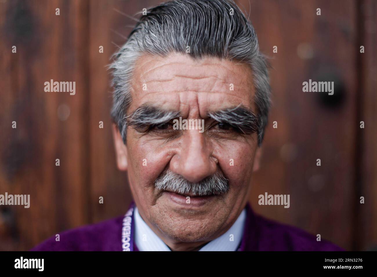 70-year-old Jose Fabio Moreno poses for photos before the procession of ...