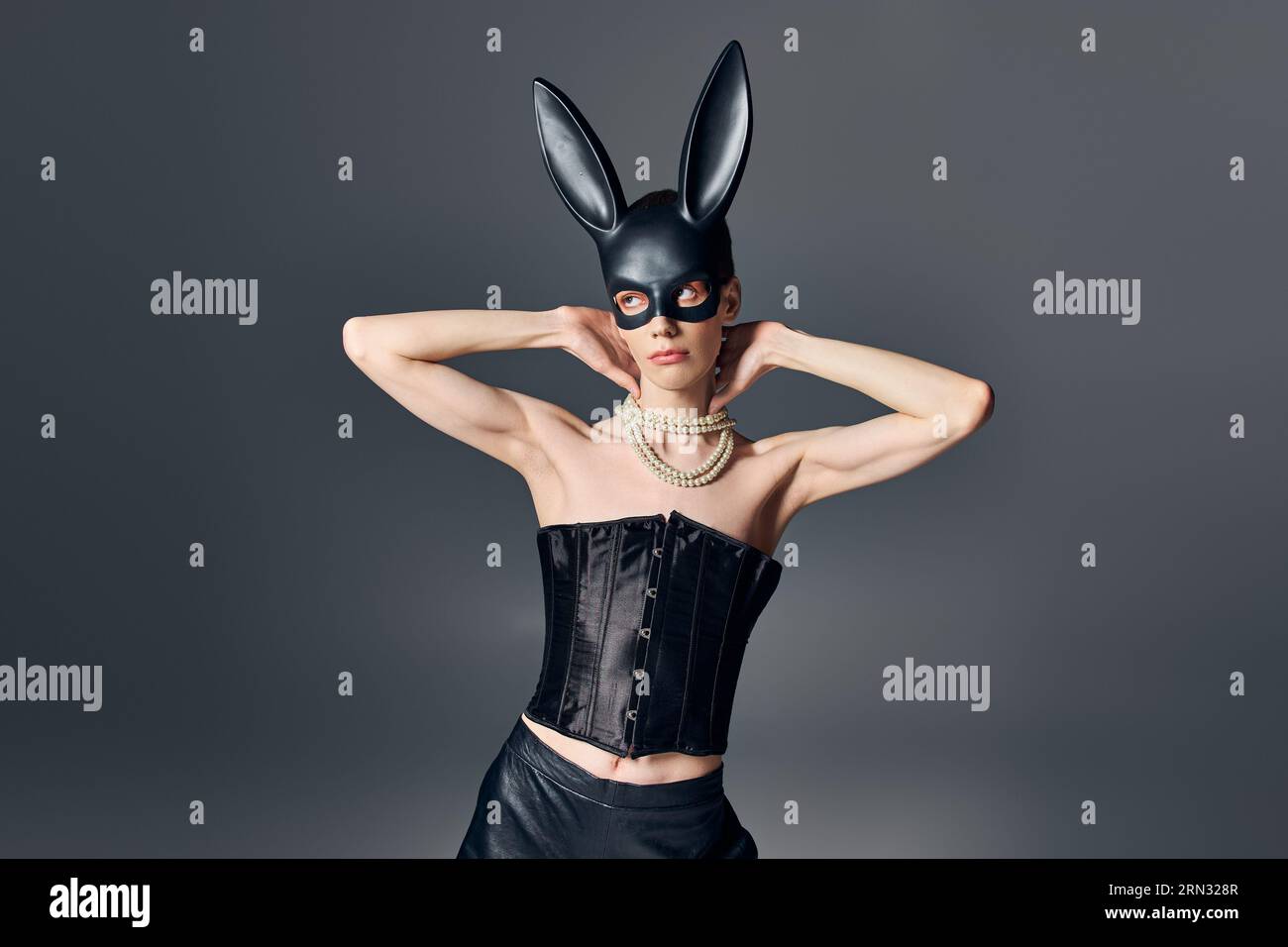 Queer Model In Black Corset And Bdsm Bunny Mask On Grey Androgynous 8634