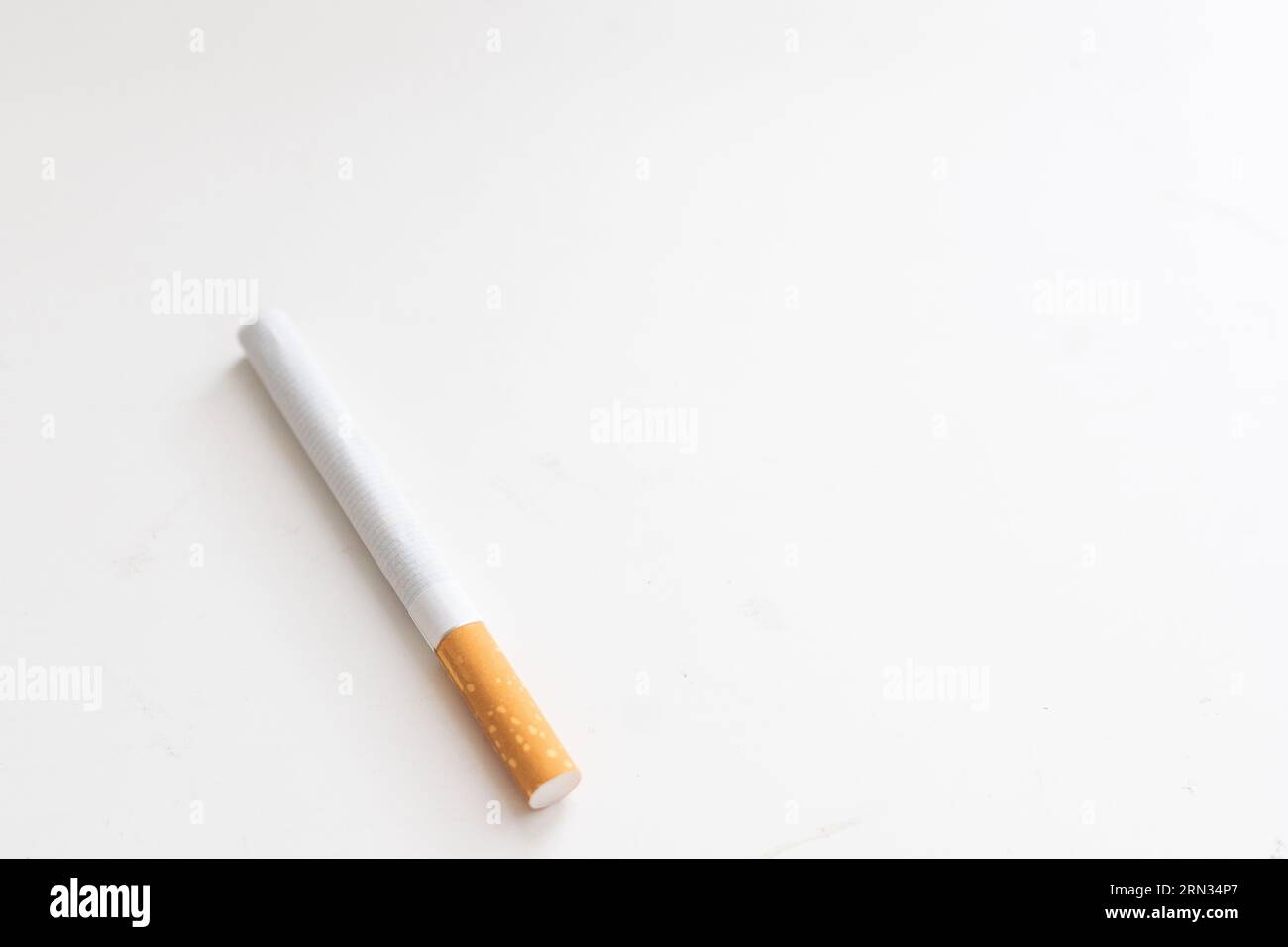 Whole cigarette on white background Stock Photo - Alamy