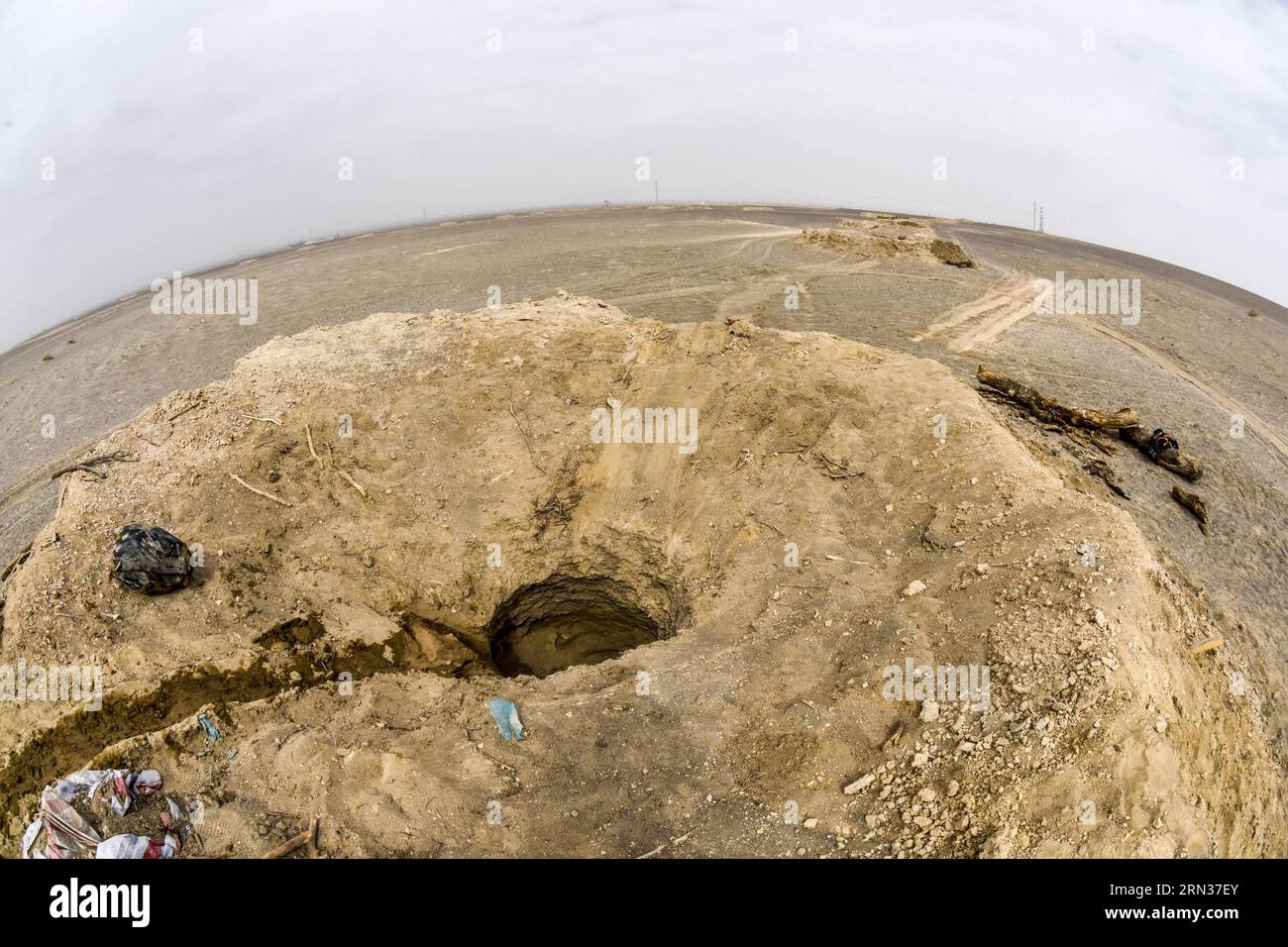 TURPAN, 2015 -- Photo taken on April 3, 2015 shows karez wells in ...