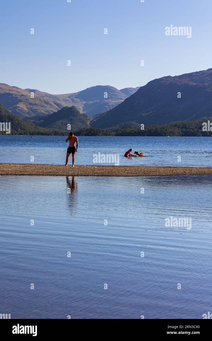 Swimmers and bathers in Derwentwater at the town of Keswick in the Lake ...
