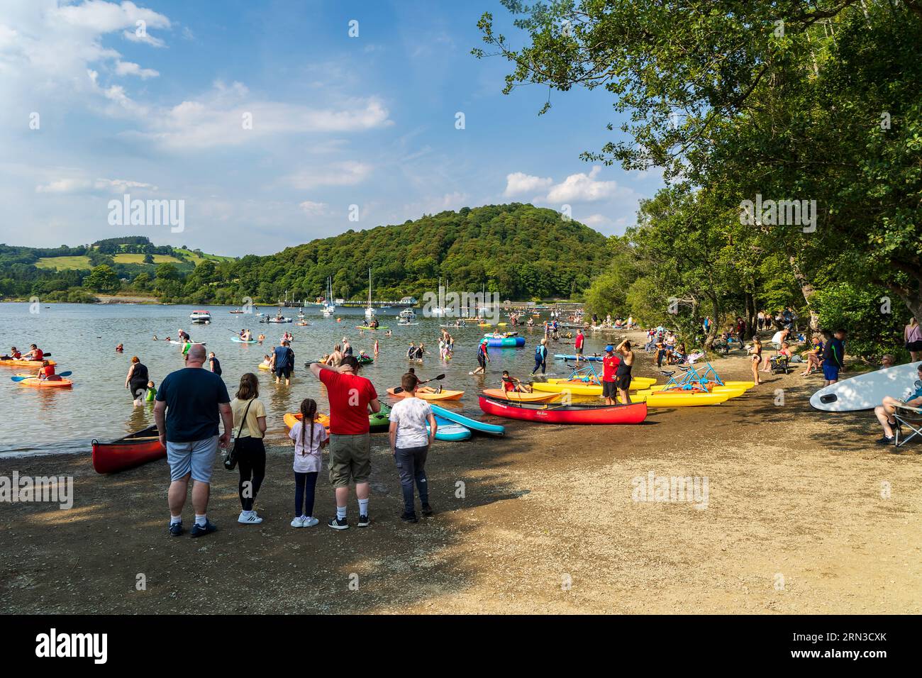 Crowds of people with swimmers on the shores of Ullswater in the ...