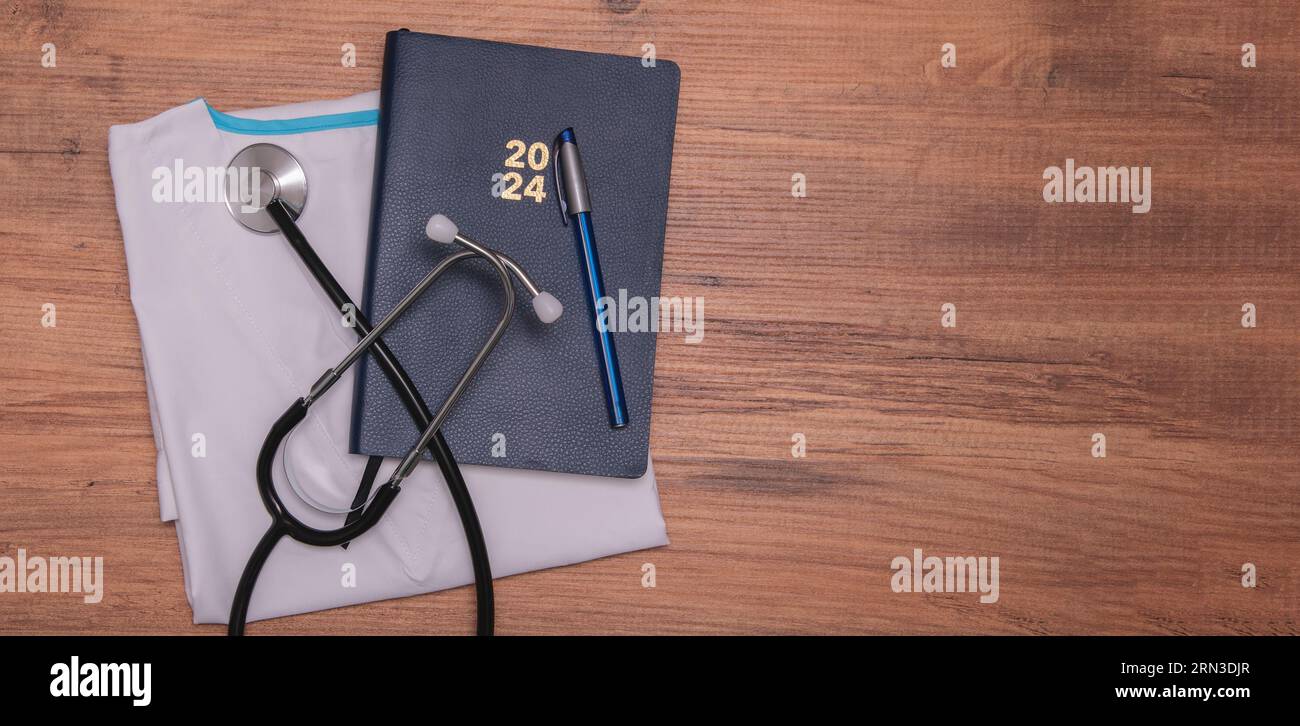 Pen, stethoscope, lying on a medical gown. Doctor's Day. Close-up, no ...