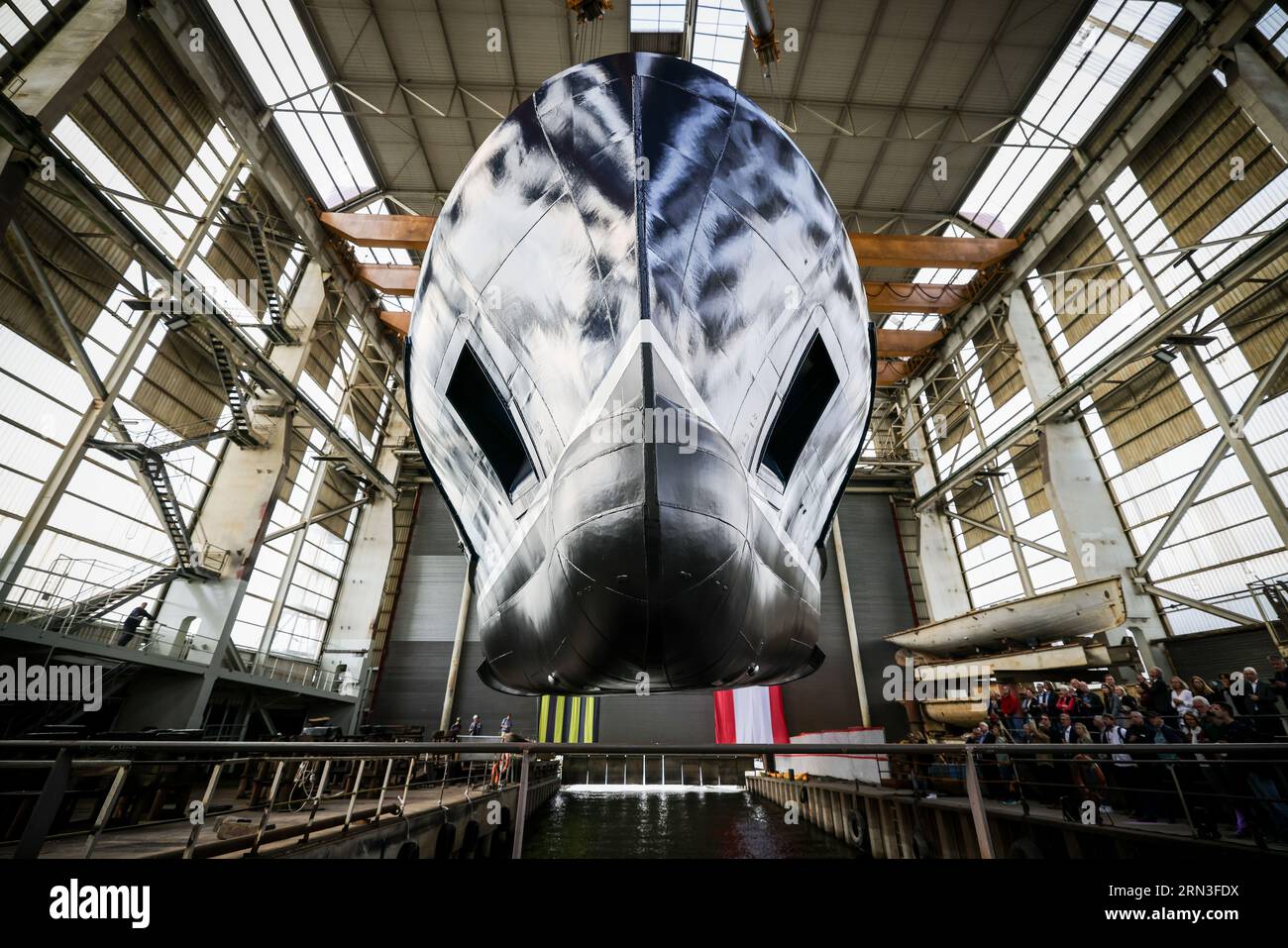 Lauenburg, Germany. 31st Aug, 2023. The shell of the research vessel "Coriolis" is put into the ...