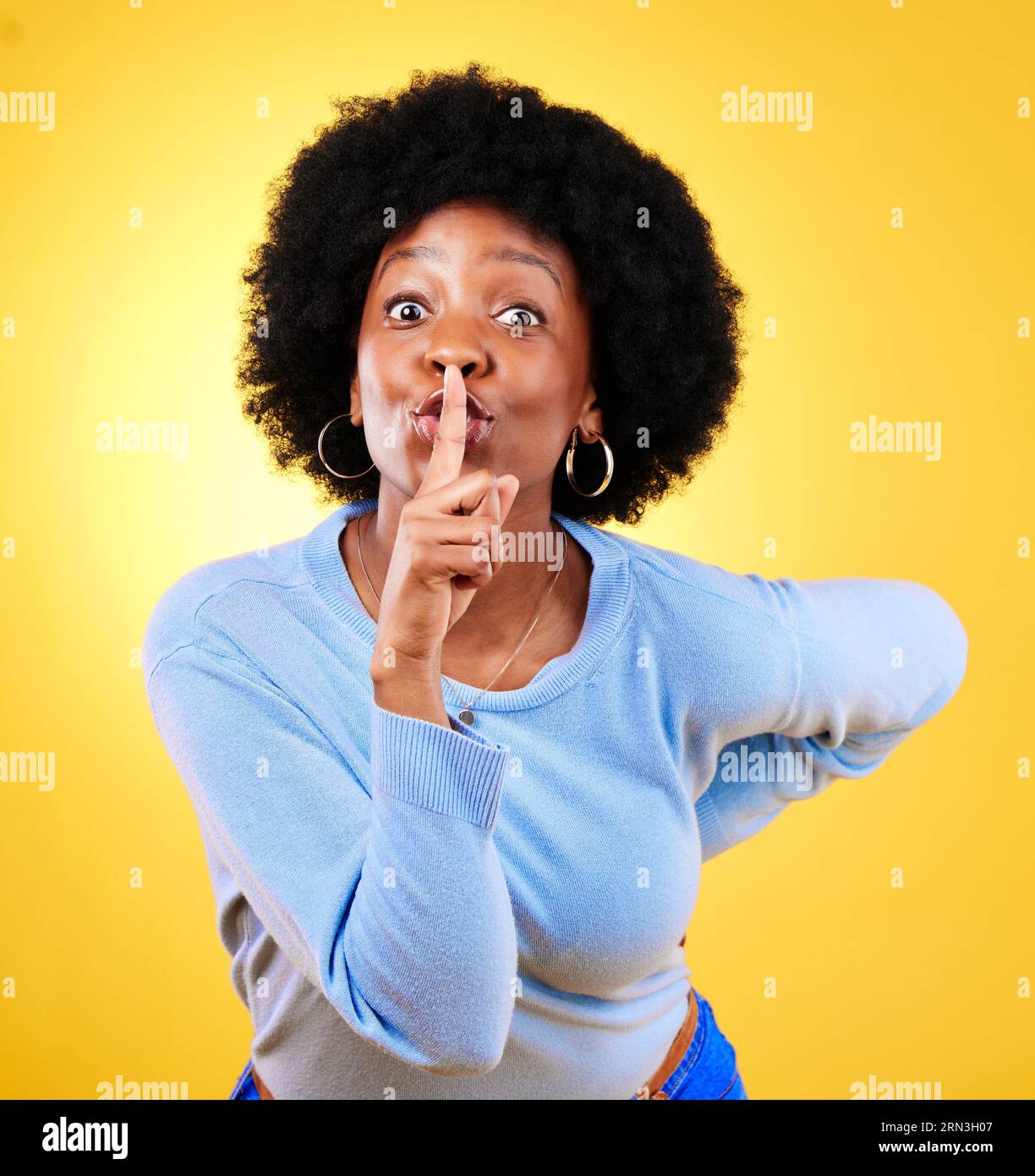 Secret, portrait and black woman with finger on lips in studio for ...