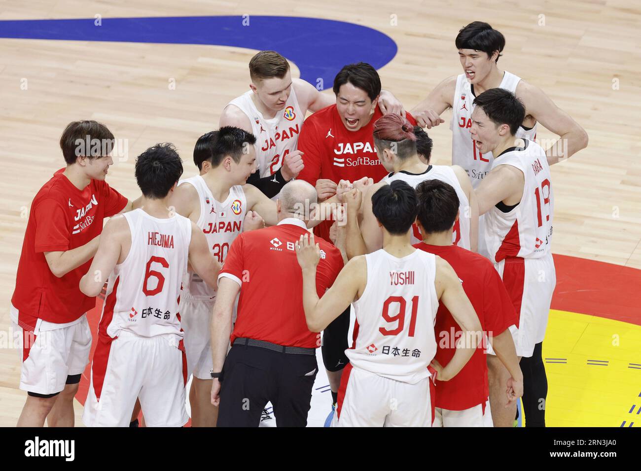 Japan players huddle together after beating Venezuela in a FIBA ...